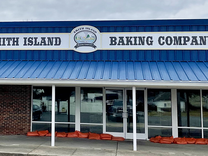 The blue-fronted bakery stands like a beacon of sweetness in Crisfield, promising layer upon layer of Maryland tradition behind those glass doors.