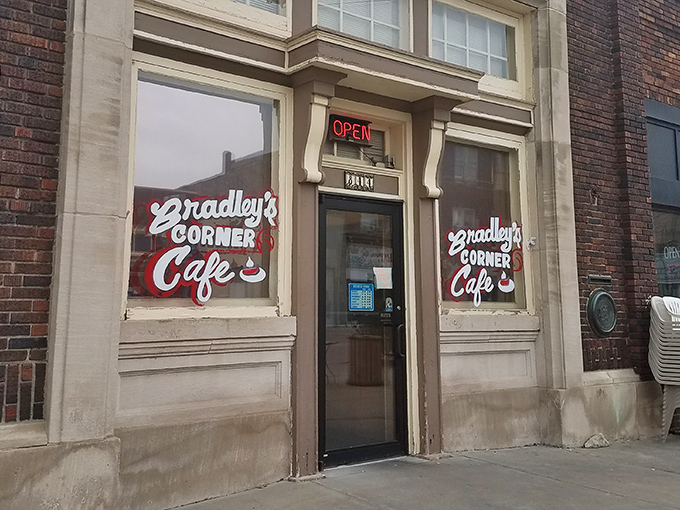 The iconic red signage of Bradley's Corner Cafe beckons hungry travelers like a culinary lighthouse in downtown Topeka.