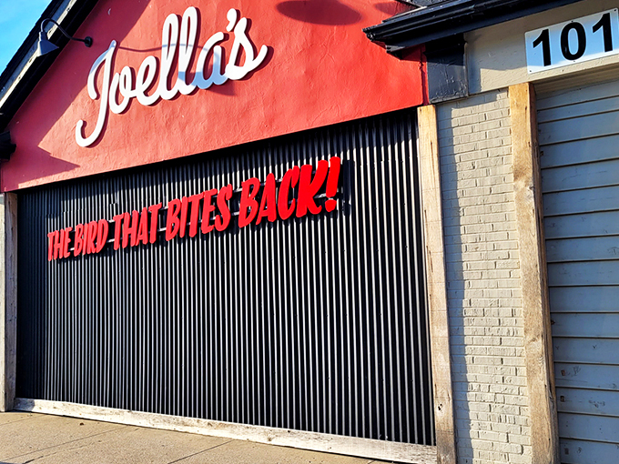The Bird That Bites Back! isn't just a catchy slogan&mdash;it's a fiery promise painted across Joella's distinctive red facade that beckons heat-seekers from miles around.