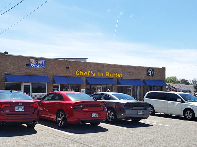 The unassuming brick exterior with bright blue awnings is like a culinary Clark Kent – ordinary on the outside, superhero-level deliciousness within.