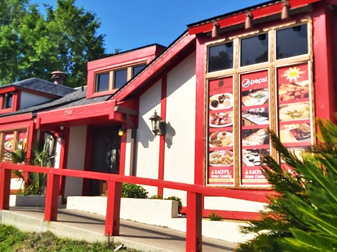 The red-trimmed exterior of Kacey's Buffet glows with promise at dusk, like a beacon calling hungry travelers to a homestyle feast.