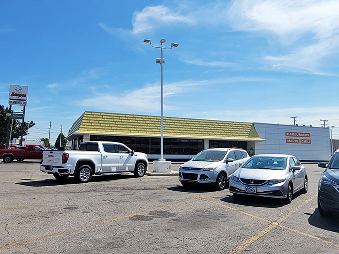 The unassuming white building with its cheerful yellow roof houses burger magic that's been drawing pilgrims to Lima for generations.