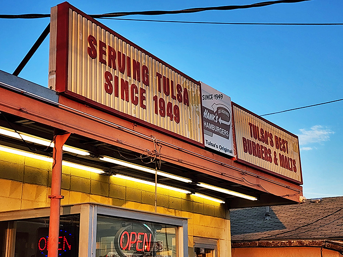 The neon promise of burger paradise! Hank's iconic sign has been guiding hungry Tulsans to burger bliss since the days when Elvis was still topping the charts.