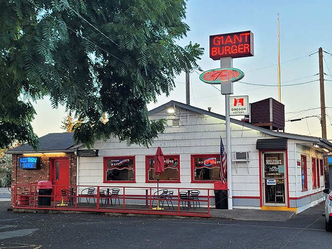 The unassuming white clapboard exterior of Giant Burger stands like a time capsule, its bold red sign promising exactly what generations of Oregonians have come to crave.