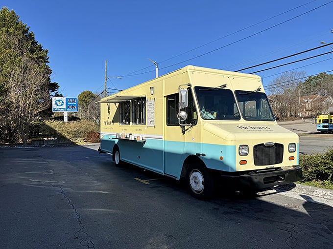 The mint-blue and cream-colored Mr. Burro food truck stands ready to serve, its donkey logo promising stubborn dedication to breakfast perfection. 