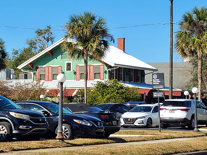 The green building with cherry-red awnings stands like a time capsule of comfort food dreams. Florida's culinary equivalent of finding a $20 bill in your winter coat.
