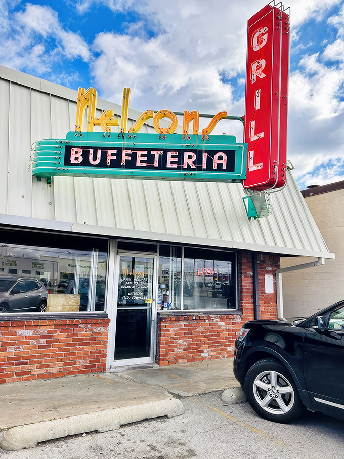 The neon sign at Nelson's Buffeteria glows like a beacon of hope for hungry travelers. This retro masterpiece promises comfort food salvation ahead.