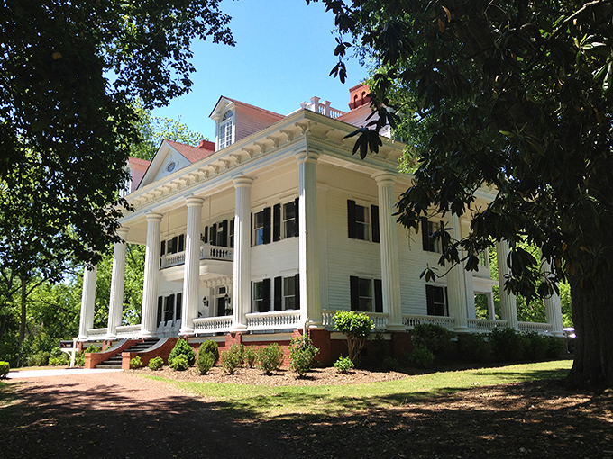 The Southern mansion of your dreams stands regally among lush greenery. Those columns aren't just holding up the porch&mdash;they're holding up two centuries of Georgia history.