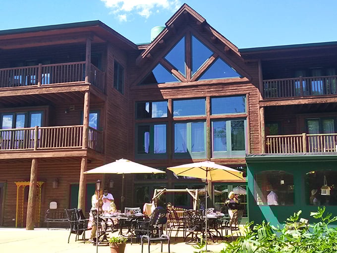 The grand timber entrance beckons with rustic elegance, promising cozy comforts behind those striking teal doors &ndash; a woodland sanctuary minutes from city bustle.