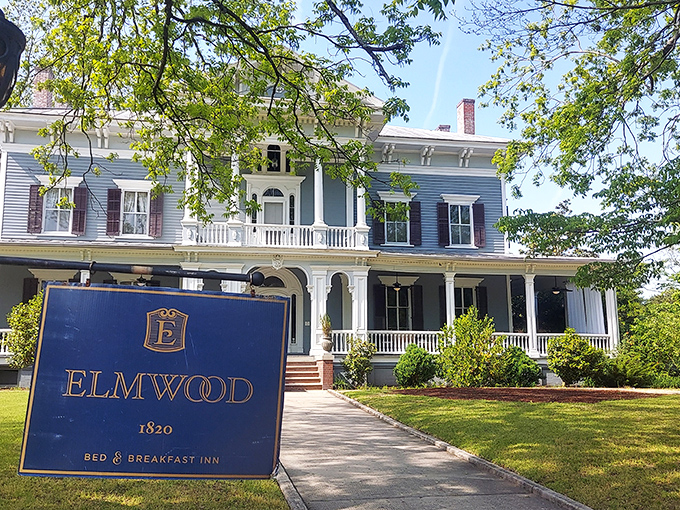 The stately blue Victorian fa&ccedil;ade of Elmwood 1820 stands proudly with its white columns and wrap-around porch, beckoning visitors to slow down and stay awhile.