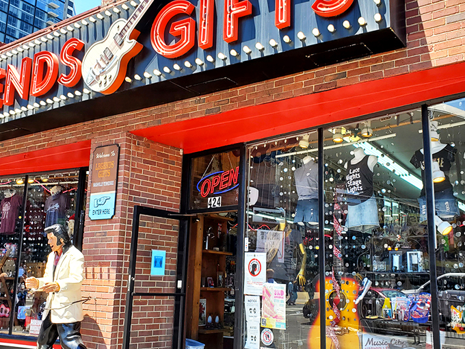 The iconic red Legends Gifts storefront beckons like a siren song to Nashville visitors. That guitar silhouette isn't just decoration&mdash;it's a promise of melodious treasures within.