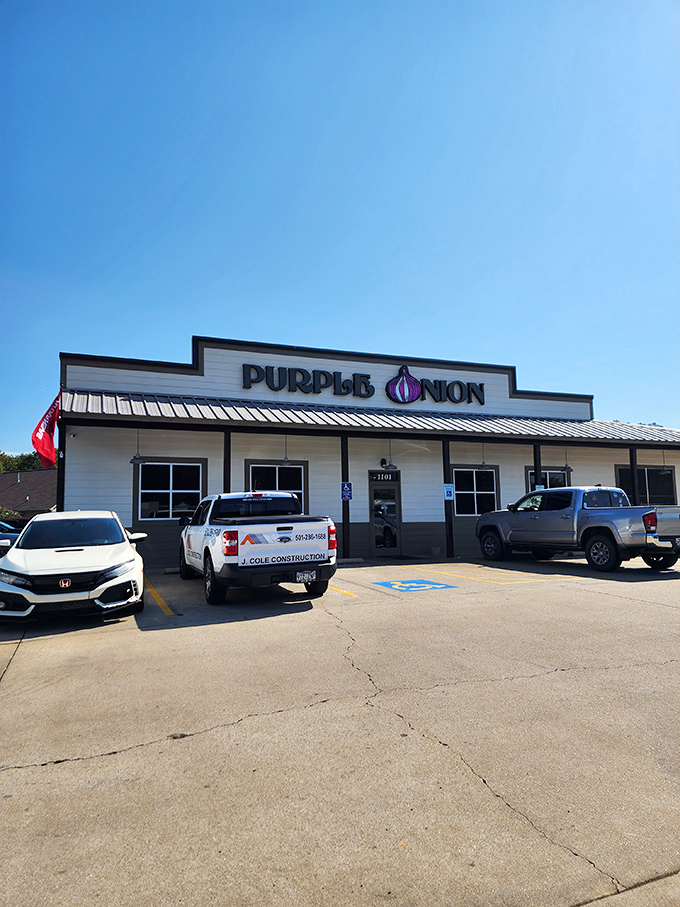 The Purple Onion's exterior beckons with its playful signage &ndash; that giant purple bulb is basically saying, "Good food happens here, folks!"