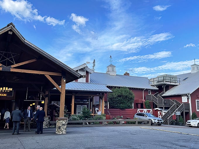 The iconic red exterior of Angus Barn welcomes diners like an old friend, its rustic charm and spacious porch promising memorable meals and Southern hospitality.
