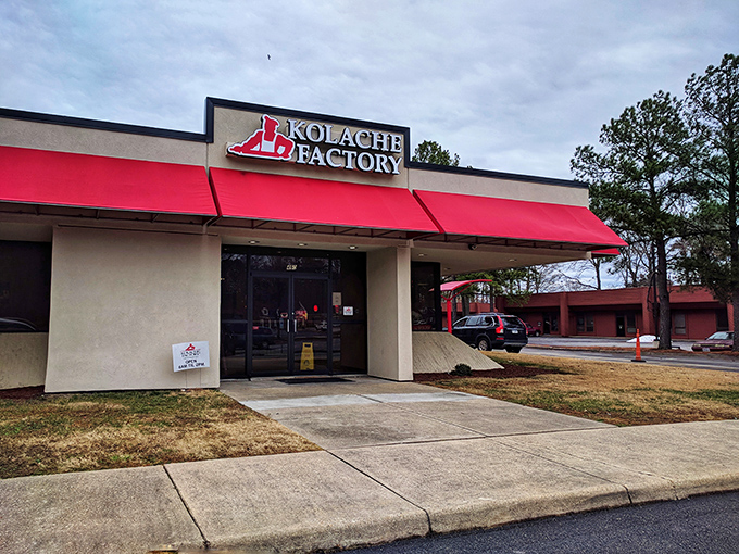 The bright red awning of Kolache Factory stands out like a culinary lighthouse, beckoning carb enthusiasts to discover Czech-inspired delights inside.