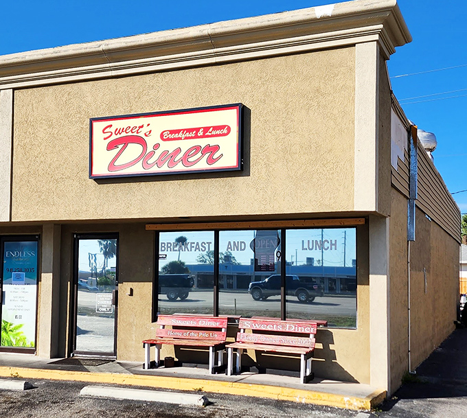 Welcome to flavor town! Sweet's Diner's retro sign promises a trip down memory lane, with a side of crispy bacon.
