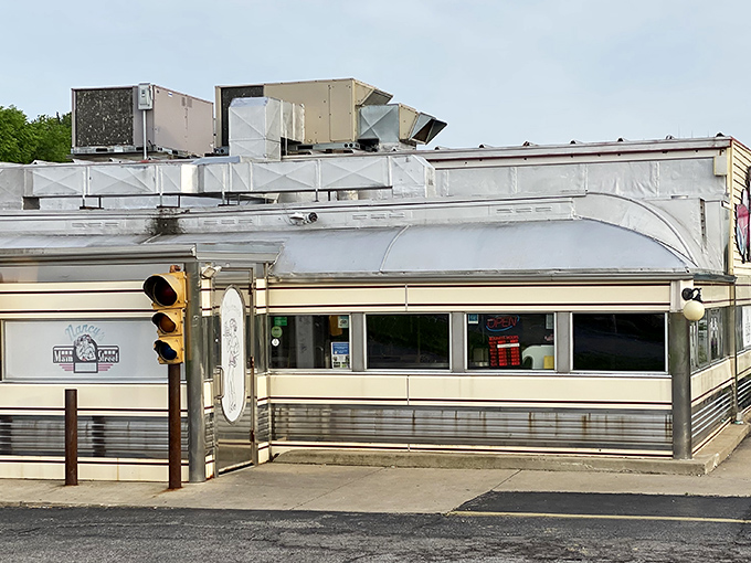 Classic Americana gleams in the rain at Nancy's Main Street Diner, where that stainless steel exterior promises comfort food treasures await inside.
