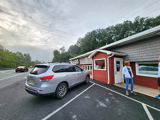 Welcome to flavor town! This cozy red exterior isn't just a diner, it's a portal to comfort food paradise. 