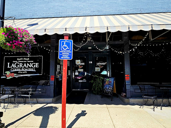 The classic storefront of La Grange Coffee Roasters beckons with its striped awning and hanging flower baskets, like a caffeine-fueled oasis on Main Street.