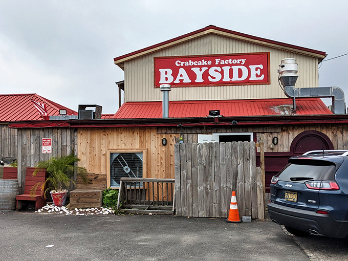 The red roof of CCF Bayside beckons like a lighthouse for the hungry. Rustic wooden exterior with character that says "seafood secrets inside."