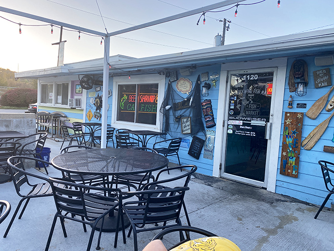 The unassuming blue exterior of The Fish Market in Liberty might fool you, but those string lights are basically saying "seafood paradise ahead!"