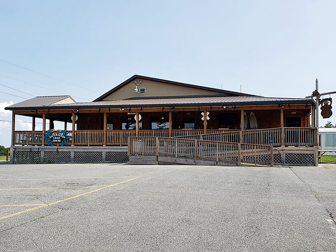 The unassuming exterior of Dave & Jane's Crabhouse beckons like a seafood siren, promising treasures within its wooden walls and wraparound porch.