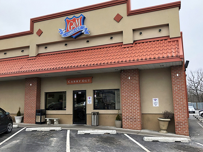 The iconic blue and red G&M sign welcomes seafood pilgrims like a maritime lighthouse, guiding hungry travelers to crab cake nirvana.
