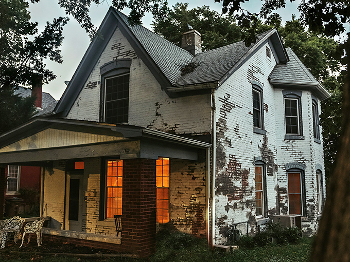 The unassuming facade of the Sallie House belies its reputation as one of America's most haunted locations. Those white walls have stories to tell.