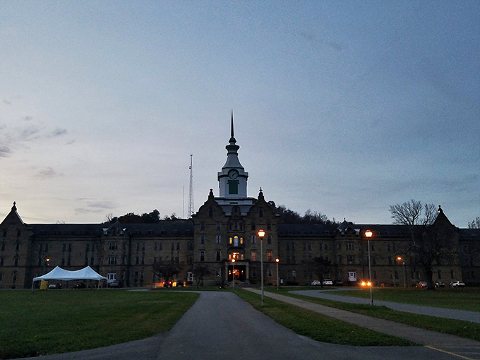 Antique medicine bottles line wooden shelves, silent witnesses to treatments once considered cutting-edge. Each glass vessel tells a story of psychiatric care's troubling evolution. 