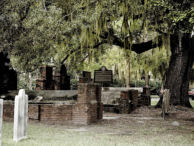 Spanish moss drapes over ancient brick structures like nature's funeral veil, creating an atmosphere that's both serene and slightly spine-tingling.
