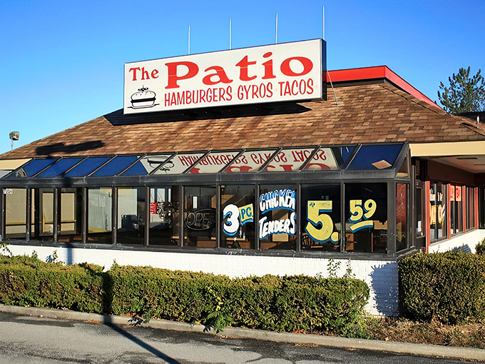 The unassuming exterior of The Patio stands like a beacon of hope for hot dog enthusiasts, its orange-trimmed patio promising simple pleasures in a complicated world.