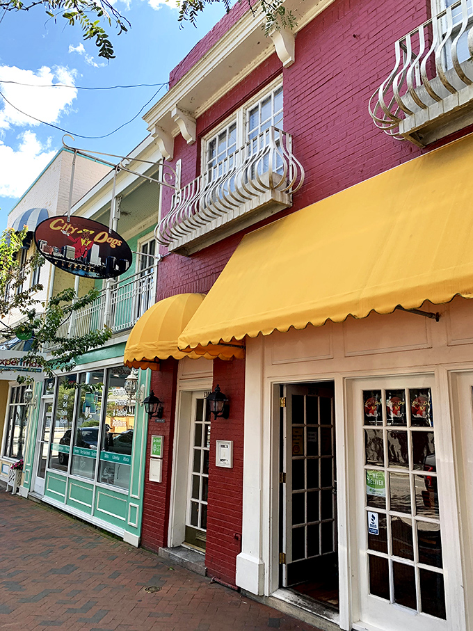 The cheerful red brick and bright yellow awning of City Dogs beckons hungry passersby like a lighthouse for the gastronomically adrift.