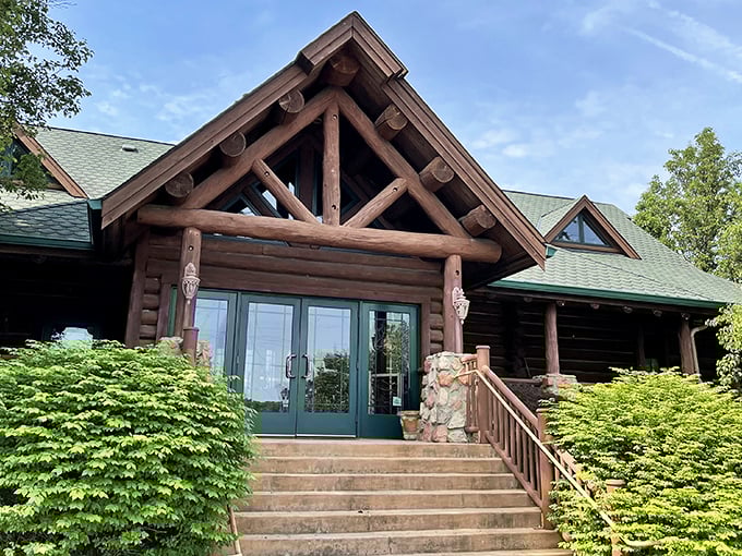 The grand timber entrance beckons with rustic elegance, promising cozy comforts behind those striking teal doors &ndash; a woodland sanctuary minutes from city bustle.
