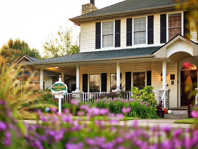 The Montford Inn stands proudly with its patriotic bunting, like that neighbor whose house always makes you feel a little guilty about your own curb appeal.
