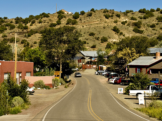 Madrid's main street welcomes you with colorful storefronts and that unmistakable small-town charm. Like stepping into a Wes Anderson film set in the high desert.