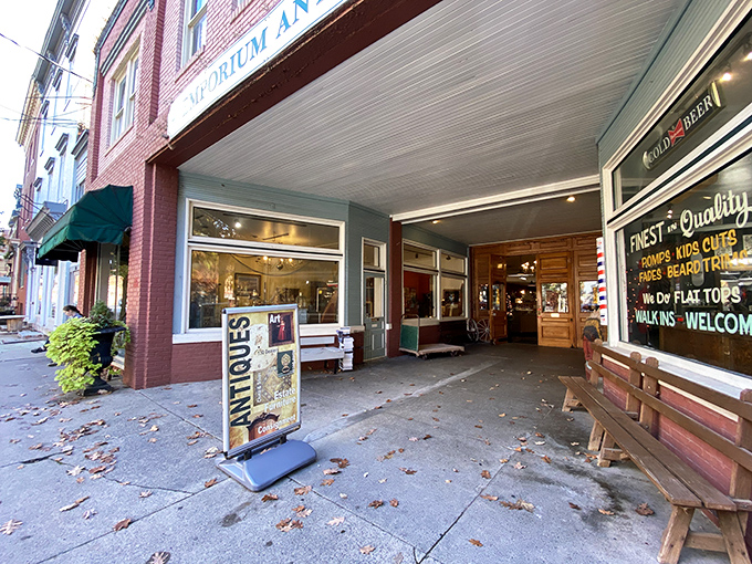 The brick facade of Emporium Antiques beckons like a time portal on Frederick's historic street. Vintage lampposts add that perfect nostalgic touch.