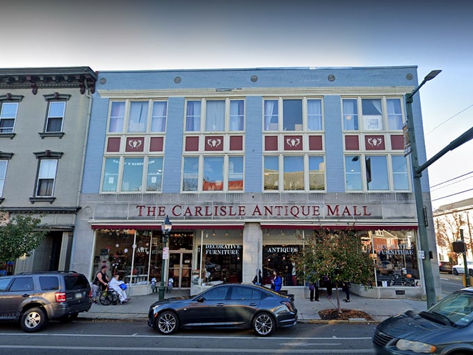 The iconic blue facade of The Carlisle Antique Mall stands like a beacon for treasure hunters on North Hanover Street.