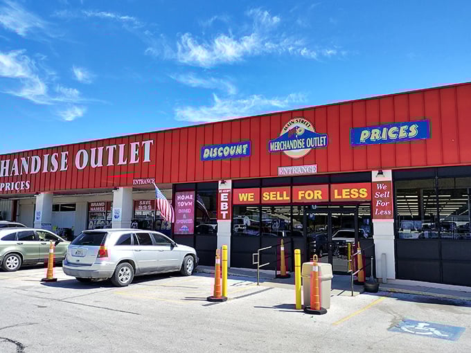 The bright red exterior of Main Street Merchandise Outlet practically shouts "bargains inside!" like a carnival barker with actual deals to offer.