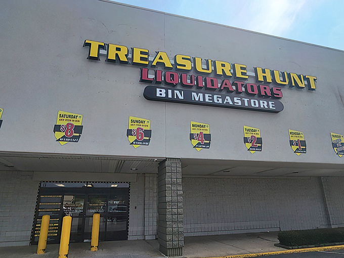 The bright yellow signage of Treasure Hunt Liquidators beckons bargain hunters like a retail lighthouse in Norfolk's commercial landscape.