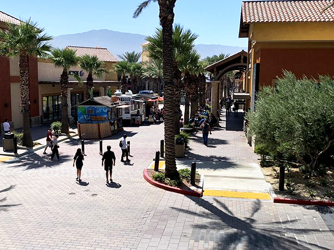 Desert chic meets shopping paradise at Desert Hills Premium Outlets, where terra cotta buildings and palm trees frame your bargain-hunting adventure.