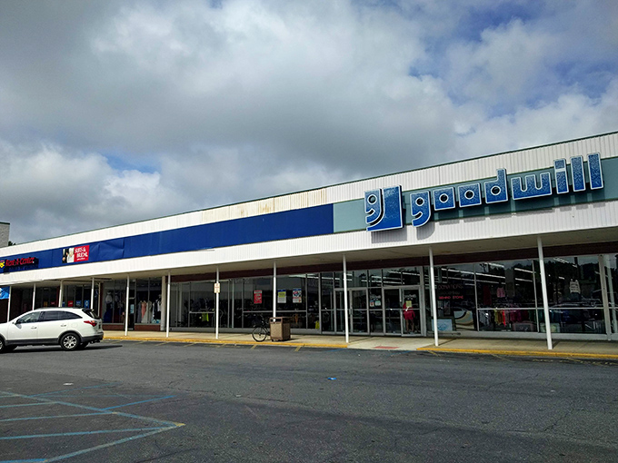 The blue-and-white facade of Dover's Goodwill beckons like a siren song to treasure hunters. What wonders await behind those sliding doors?