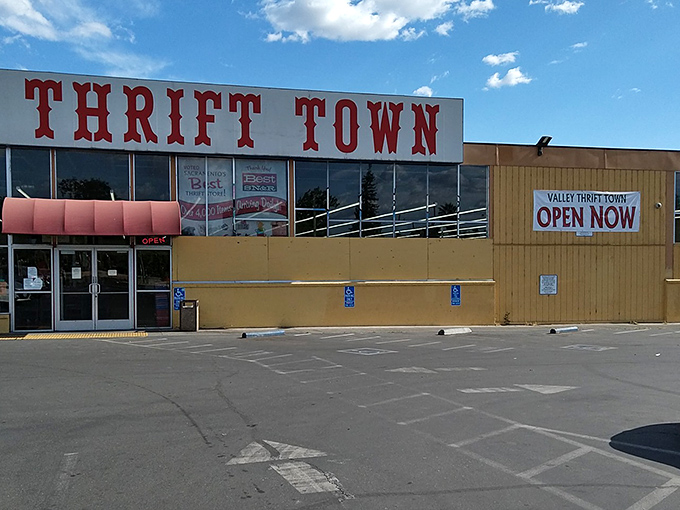The iconic red Thrift Town sign beckons like a lighthouse for bargain hunters. Sacramento's temple of thrift stands ready for treasure seekers of all budgets.