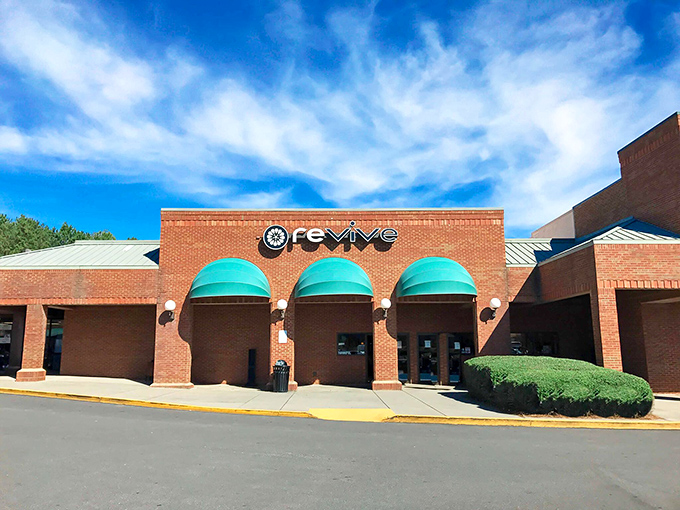 The brick facade with those distinctive teal awnings isn't just eye-catching&mdash;it's the gateway to a treasure hunter's paradise hidden in plain sight in Woodstock.