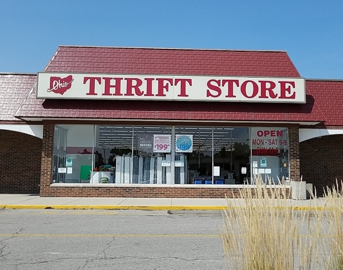 A bargain hunter's paradise awaits! This red-brick behemoth is like a siren call to thrifty shoppers everywhere.