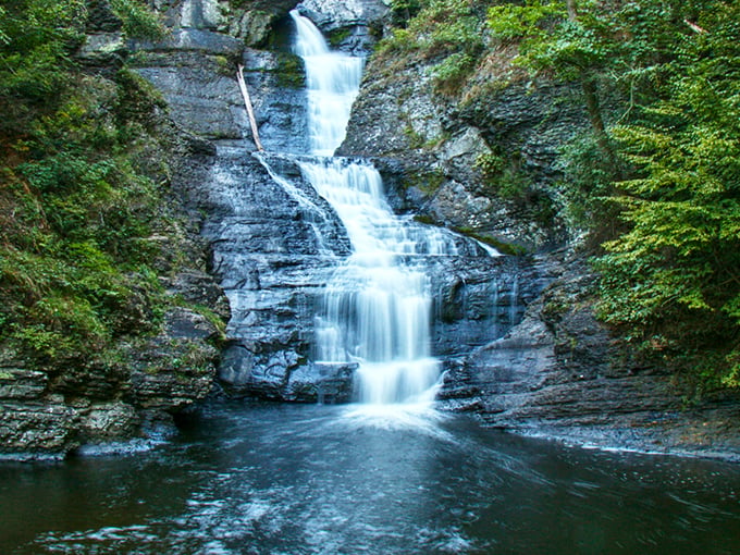 The entrance sign to paradise doesn't need neon lights. Raymondskill Falls welcomes visitors with rustic charm and the promise of natural wonder ahead. 