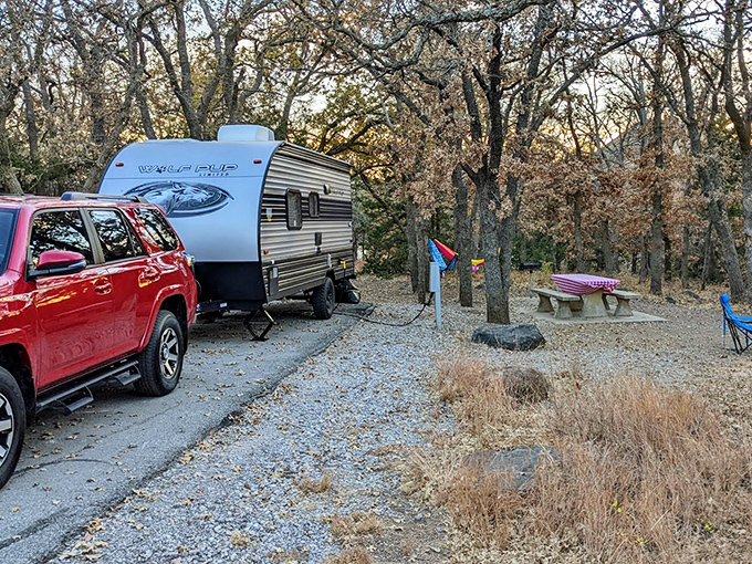 Home sweet wilderness! A cozy travel trailer nestled among autumn oaks creates the perfect basecamp for adventures in Oklahoma's rugged backcountry.