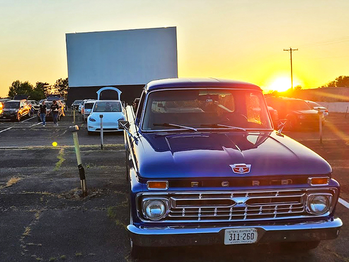 Sunset magic at the Winchester Drive-In, where vintage trucks and modern sedans share the same timeless experience under Oklahoma's painted sky.