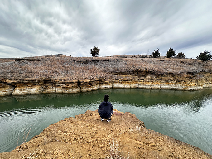 Nature's perfect meditation spot: where Kansas sandstone meets crystal waters, creating a moment of zen that no spa could replicate.