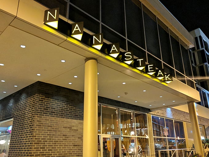 NanaSteak's illuminated sign beckons like a lighthouse for hungry souls wandering the streets of Durham, promising salvation in steak form.