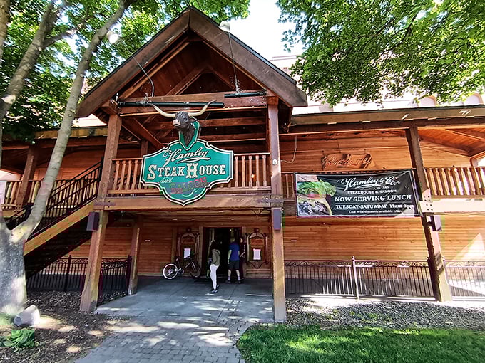 A warm wooden facade invites you to step inside this rustic steakhouse for a delicious meal and true western hospitality.