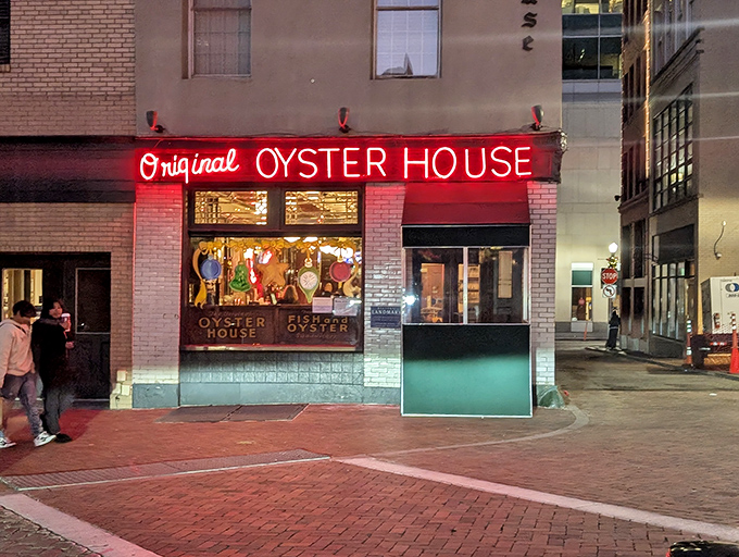The neon glow of seafood salvation! Pittsburgh's Original Oyster House stands like a time capsule in Market Square, its red sign beckoning hungry souls since long before Instagram existed.